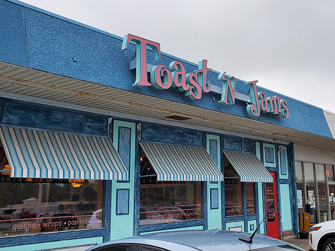 Toast 'N Jams' vibrant blue facade and playful sign hint at the creative breakfast adventures waiting just beyond those striped awnings.