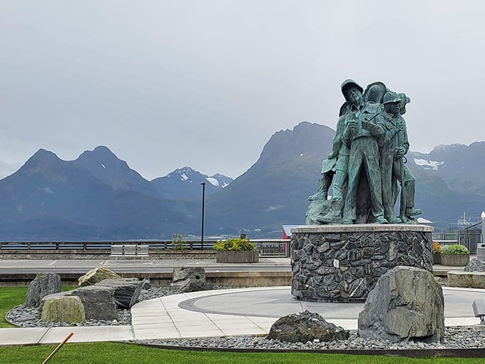 Valdez's waterfront memorial stands as a testament to those who braved the last frontier, with mountains bearing silent witness.