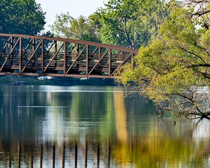 Sterling State Park's bridge reflects perfectly in still waters. Even the infrastructure is trying to take a good selfie here.