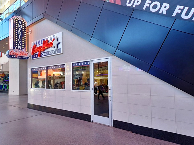 The clean white tiles of American Coney Island create the perfect backdrop for their legendary red-sauced Detroit coneys.