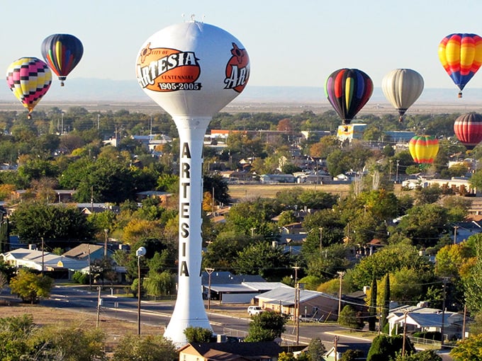 Artesia's iconic water tower stands tall against the New Mexico sky, while colorful hot air balloons add a magical touch to this affordable retirement haven.