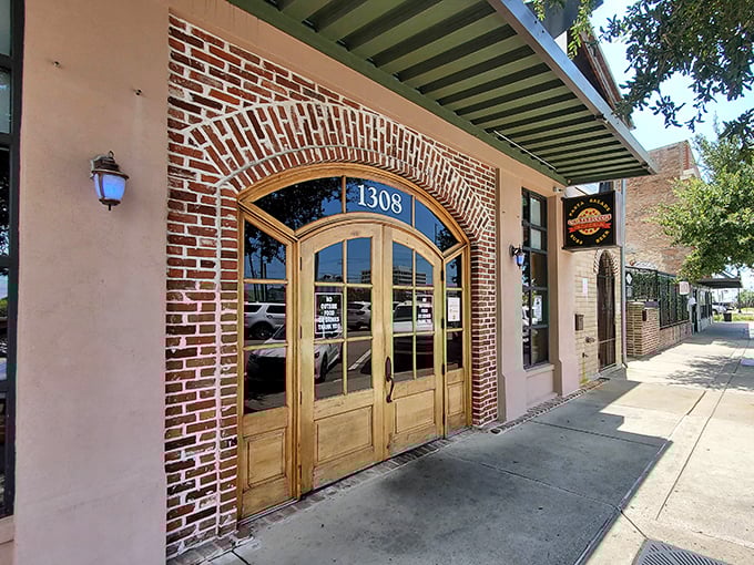 Sarducci's charming storefront blends historic architecture with modern pizza craft. Those wooden doors practically invite you in for a slice!