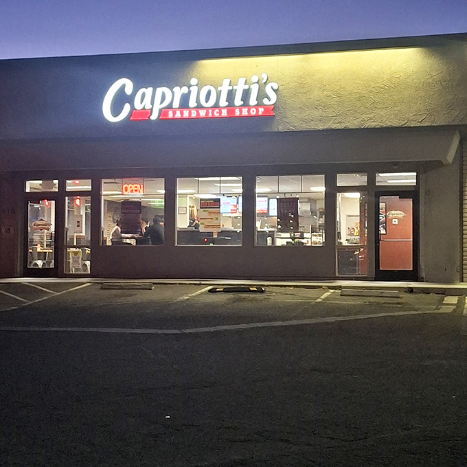 As night falls, Capriotti's glowing sign reminds night owls that great sandwiches don't follow banker's hours.