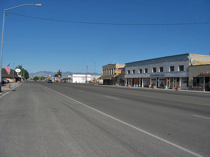 Delta's Main Street stretches toward distant mountains under a big western sky. The definition of "wide open spaces" in small-town form.