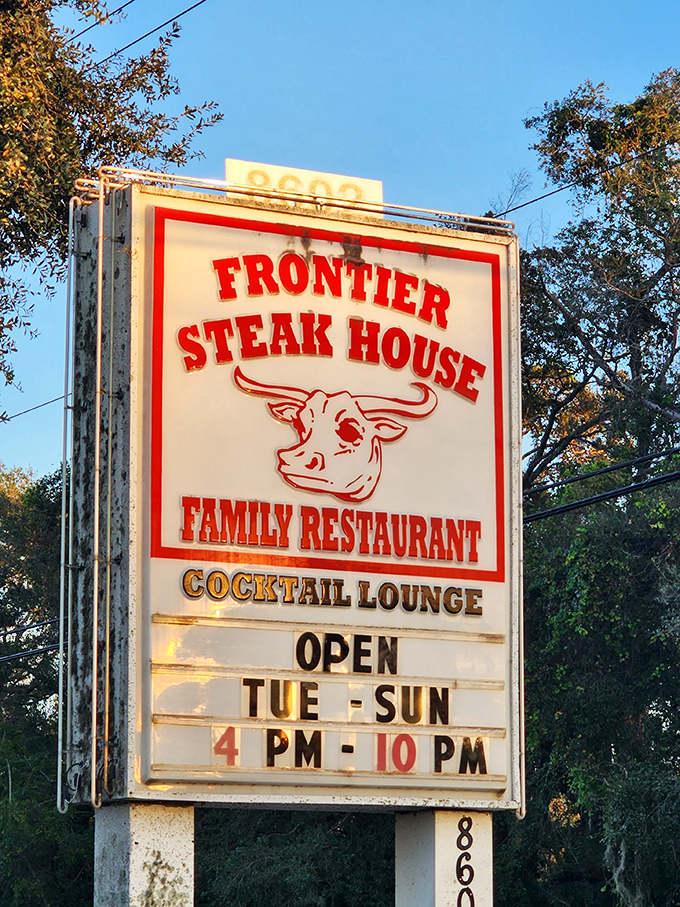 The vintage sign at Frontier Steakhouse promises exactly what you'll get: no-nonsense steaks served with a side of nostalgia.