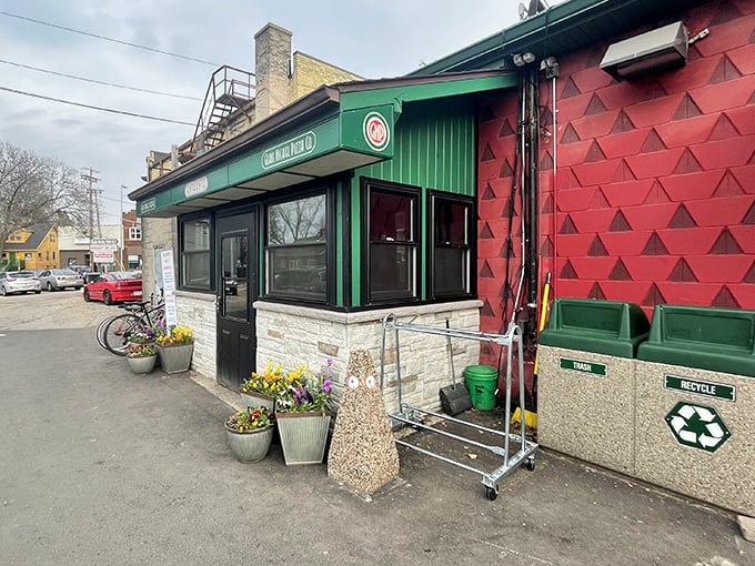 Even in winter, Glass Nickel's entrance promises warmth through pizza perfection. Those recycling bins say "guilt-free indulgence"!