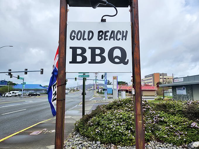 Follow the sign to flavor town! This roadside marker points the way to where ocean breezes meet hickory smoke.