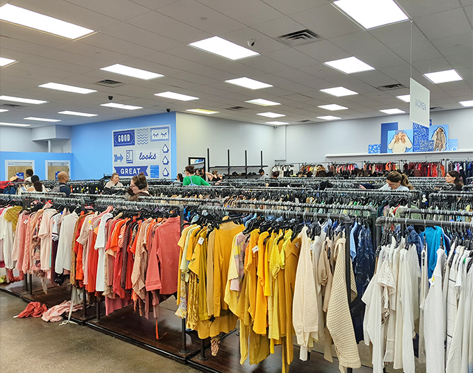 Color-coded fashion paradise! Goodwill's fluorescent-lit wonderland organizes yellows, pinks, and whites like a department store from a parallel, more affordable universe.
