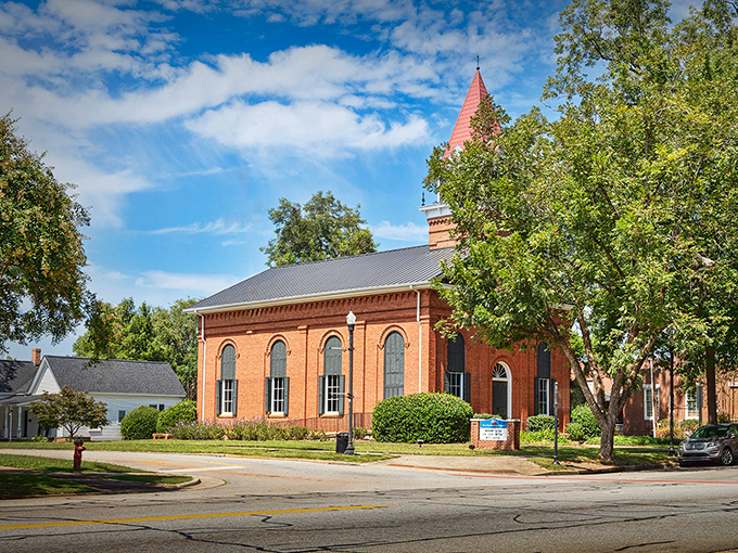 Brick sidewalks lead past colorful storefronts in a downtown that balances historic charm with modern convenience.
