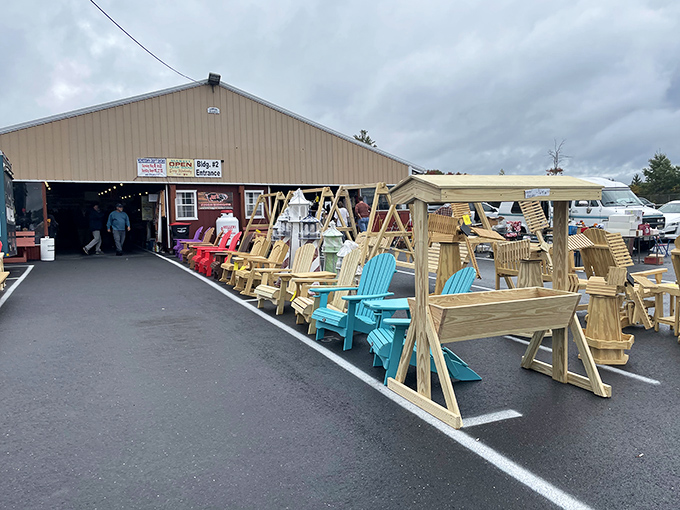 Handcrafted wooden furniture parade &ndash; where Adirondack chairs in Crayola colors wait to brighten someone's patio or porch.