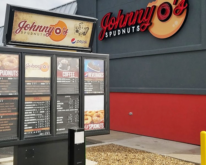 That drive-thru menu board might as well say "Life-Changing Spudnuts: Just Order Already!" The red building practically vibrates with potato-donut potential.