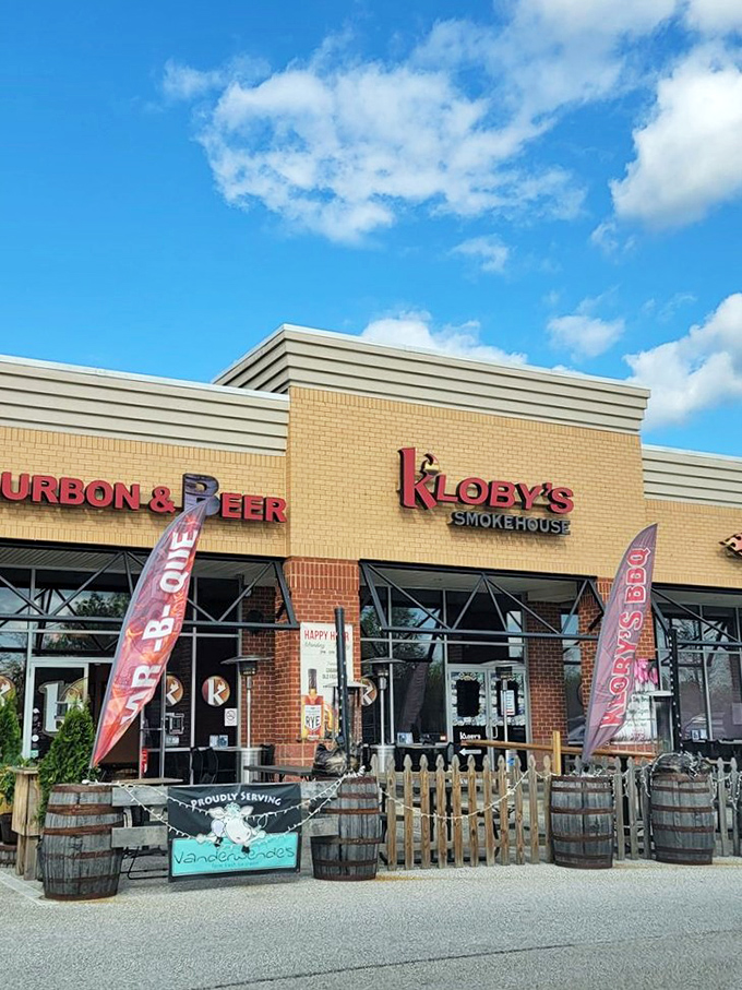 Kloby's outdoor setup with barrel decor tells you exactly what matters here: smoked meat and aged spirits. Some marriages are truly made in heaven.