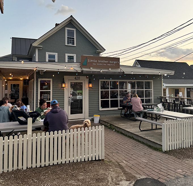 Evening lights transform Little Brother's patio into a magical burger garden where conversations flow as freely as the flavor.