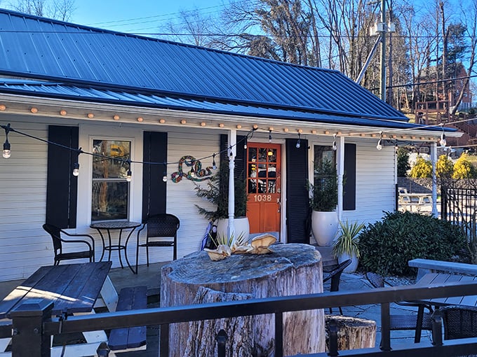 Cottage charm meets culinary craft at Lola's. The blue metal roof and string lights create pizza's perfect setting.