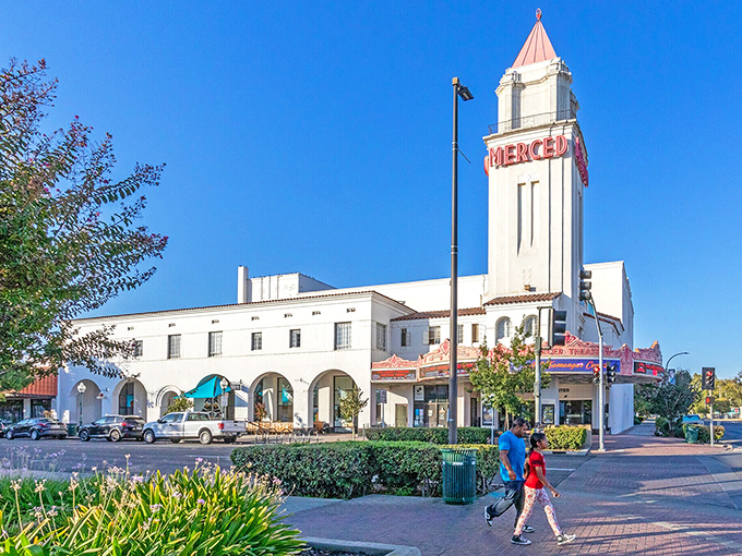 The historic theater tower stands as downtown's landmark, where community still gathers like in the good old days.