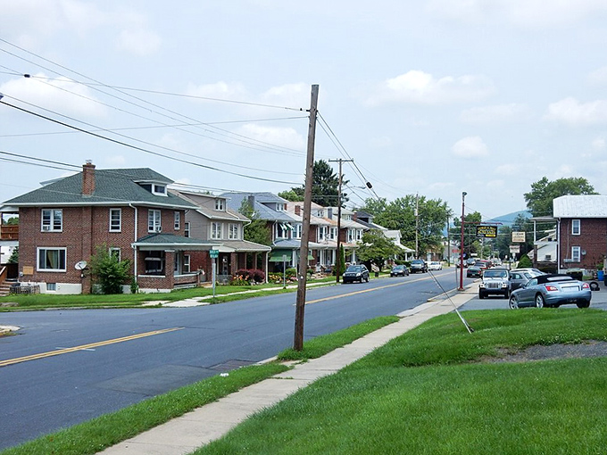 Tree-lined residential streets invite leisurely strolls where front porches still serve their original social purpose perfectly.