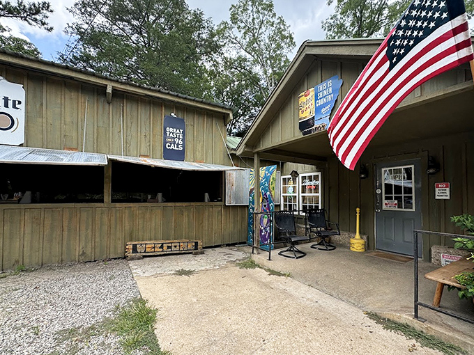 The American flag waves a patriotic hello outside Paradise Pizza, where rustic charm meets cheese-pull perfection.