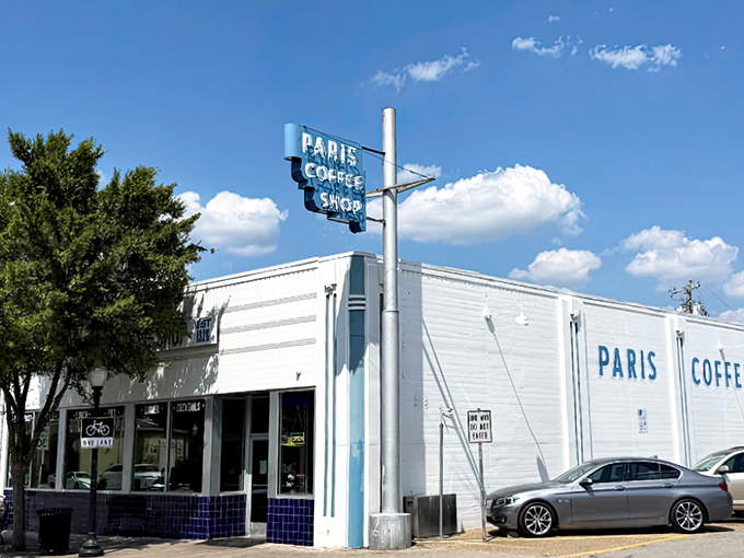 The classic blue and white exterior of Paris Coffee Shop hides Fort Worth's breakfast treasure. That vintage sign has guided hungry folks for generations!