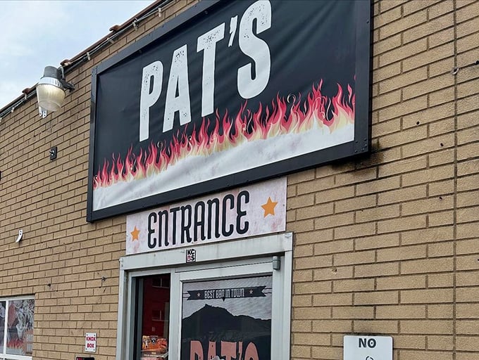 Pat's entrance doesn't need fancy frills&mdash;just flames on the sign and promise in the air. BBQ this good speaks for itself.
