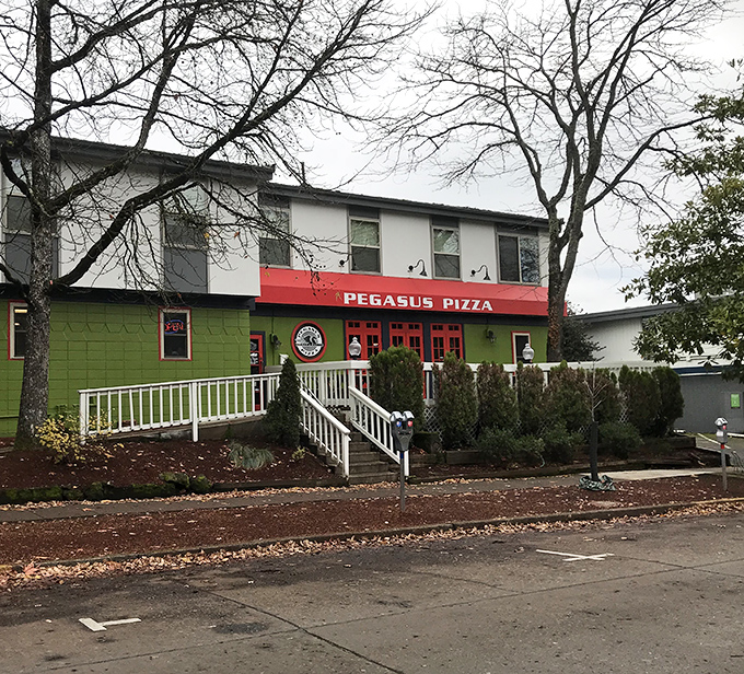 The cozy porch with white railing welcomes you to Pegasus, where pizza legends are born one perfect cheese pull at a time.