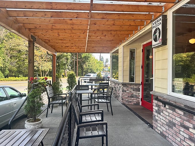The covered porch at Pulcinella offers the perfect perch for savoring wood-fired wonders in all seasons.