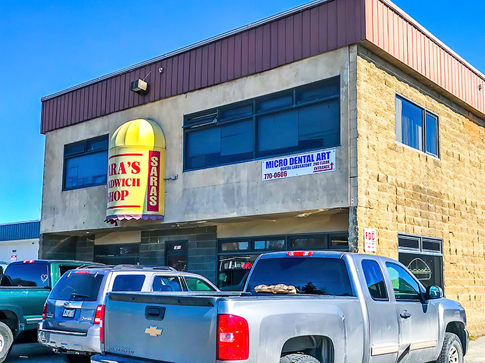 No-nonsense sandwich headquarters with that unmistakable yellow sign. Architectural simplicity housing flavor complexity.