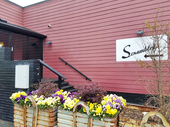 The red exterior and thoughtful landscaping hint at the creative care that goes into every plate that emerges from this kitchen.