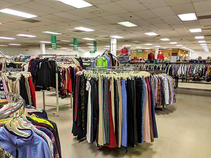 Inside Smyrna Thrift Store, circular racks create a maze of possibilities where fashion treasures hide in plain sight.