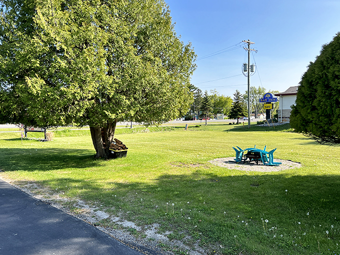 Small-town tranquility spreads beneath shade trees like a Norman Rockwell summer afternoon.