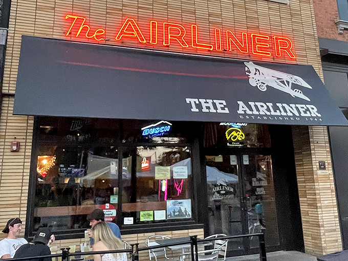 The Airliner's neon sign glows like a beacon for the pizza-hungry. Some traditions, like great pizza in a historic spot, never go out of style.