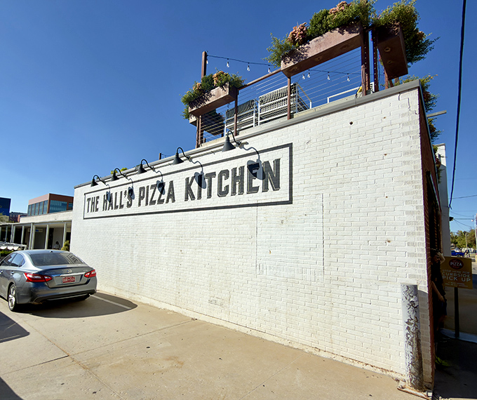 That clean white brick exterior? It's like the canvas before the masterpiece—just wait until you taste what's cooking inside.