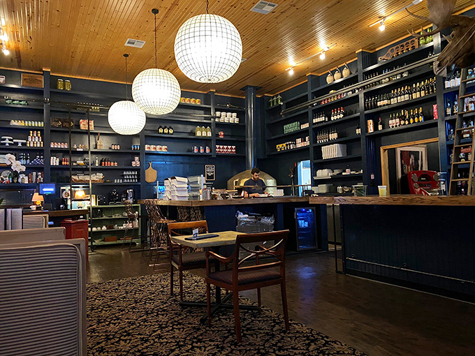 Those warm wooden shelves lined with ingredients tell you everything – this is a place that takes pizza seriously.