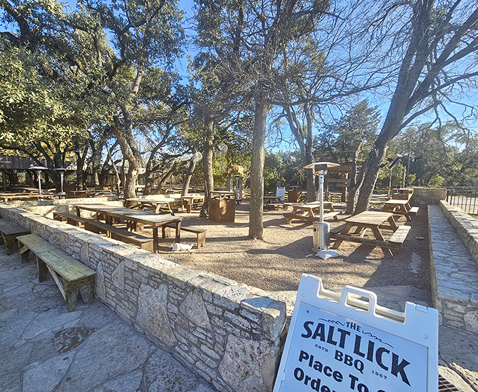 Salt Lick's rustic outbuildings look like they grew naturally from the Hill Country soil. Barbecue architecture at its most authentic.