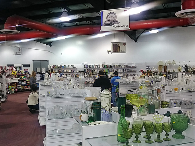 Green glassware gleams like emeralds under fluorescent lights—yesterday's entertaining essentials awaiting their next dinner party.