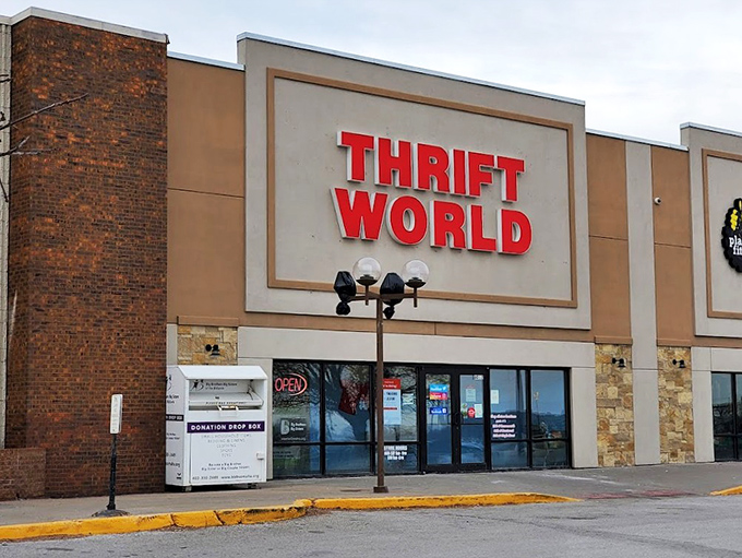 Even the streetlamp seems to spotlight this thrift store's potential. Day or night, the promise of unexpected finds keeps drawing people in.