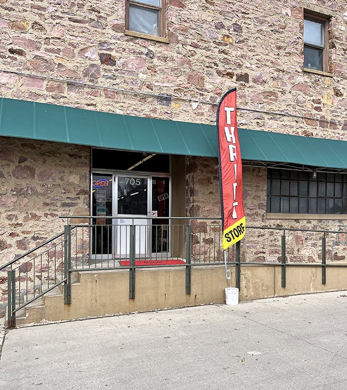 The stone building stands as a testament to permanence in a world of fast fashion and disposable goods.