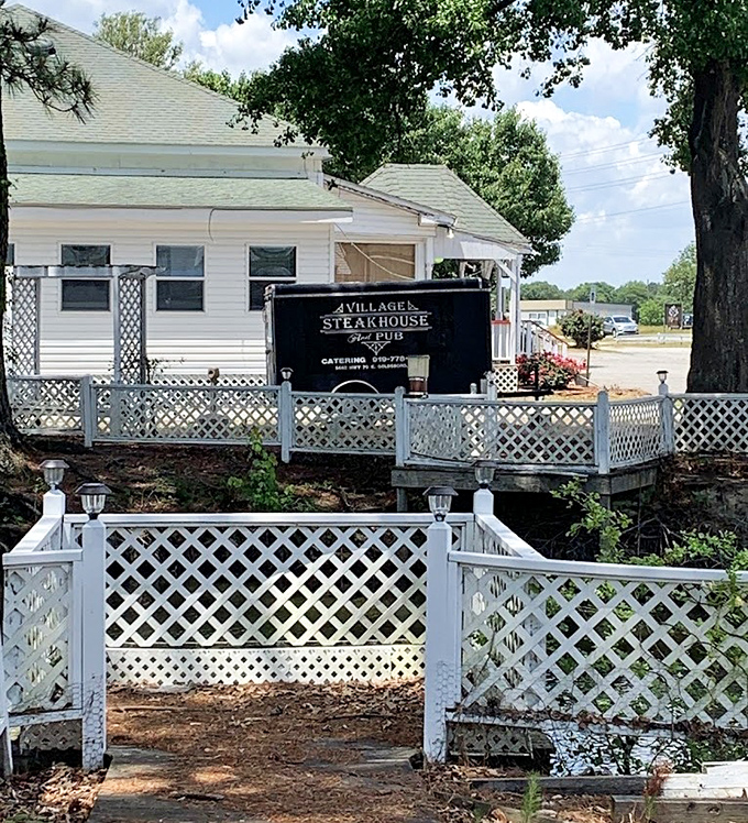 Behind that picket fence lies steak paradise - where neighborhood charm creates unforgettable dining memories. 