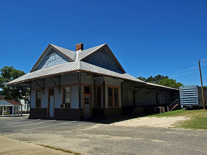 The old train depot sits quietly, a reminder of when life moved at locomotive speed.