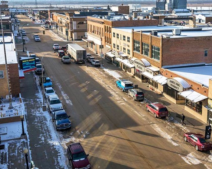 Downtown's brick-faced buildings house local businesses where shopkeepers still remember your name and your coffee order &ndash; Main Street America alive and well.