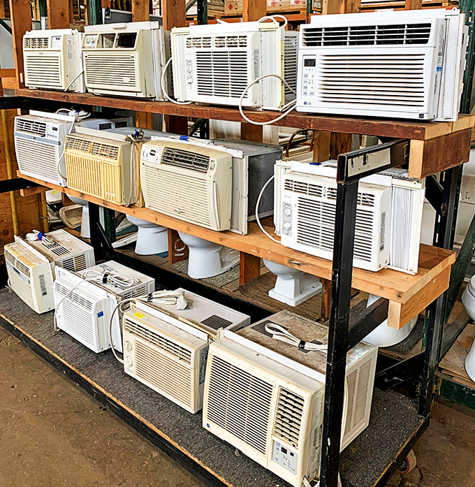 Window air conditioners stacked like a summer survival kit, because Maryland humidity waits for absolutely no one, friends.