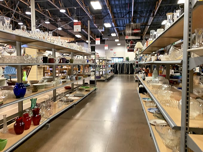 Crystal and glassware line the aisles like a museum of domestic history, where vintage punch bowls meet modern wine glasses.