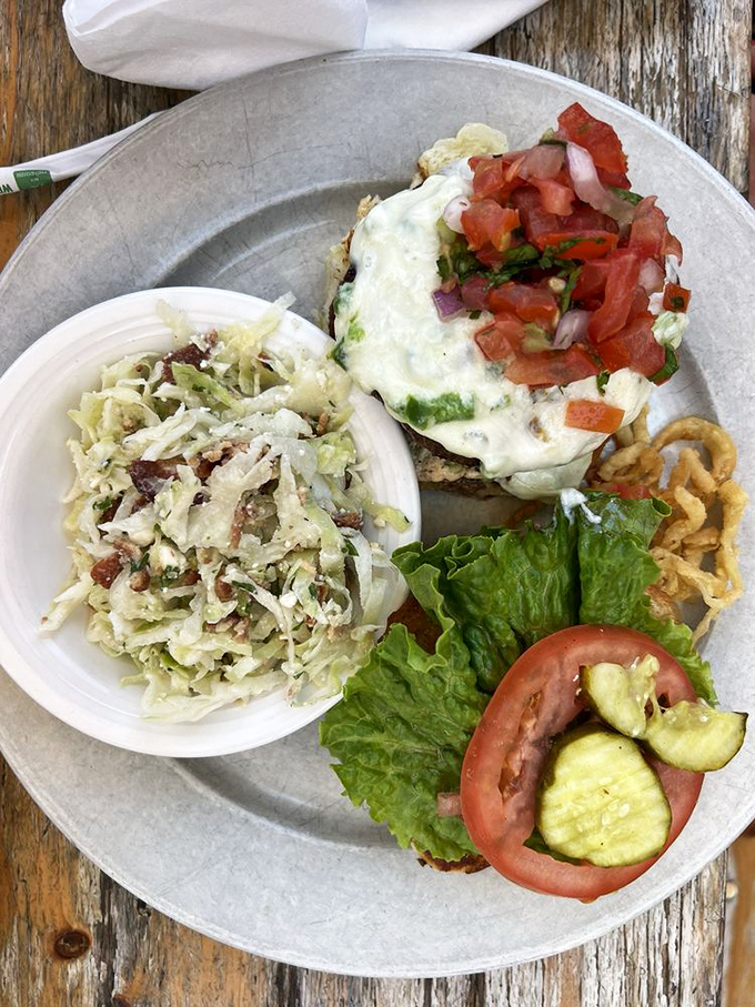 The Amontillado burger arrives with coleslaw sidekick—a duo so perfect together you'll want to wall them up in your memory forever.