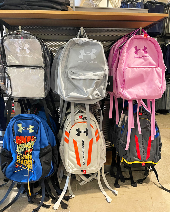 Under Armour backpacks stand at attention, ready for everything from school assignments to beach adventures&mdash;practical luxury at outlet prices.