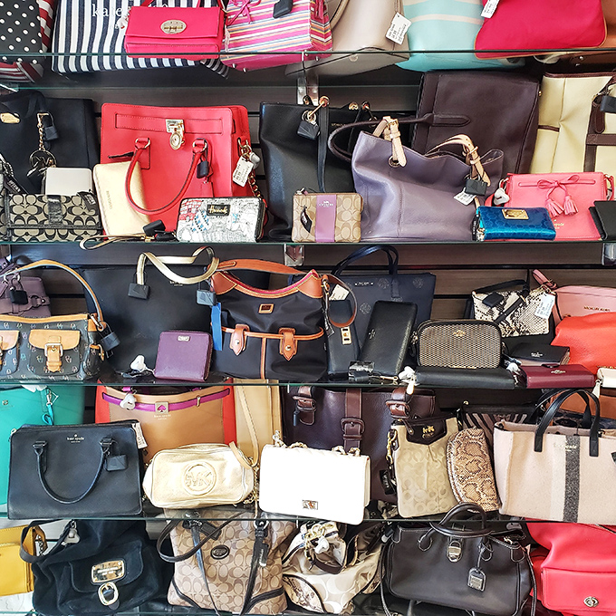Designer handbags line the shelves like a candy store for fashion lovers—Coach, Kate Spade, and Michael Kors all waiting for their second chance at glamour.