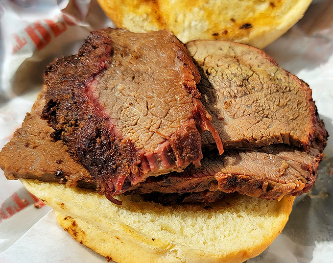 Brisket slices with that telltale pink smoke ring&mdash;the barbecue equivalent of a designer label. Each slice tells a story of time and smoke. 