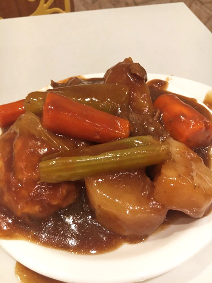 Beef stew that looks like it simmered since breakfast, with vegetables and gravy mingling in the kind of harmony that makes orchestra conductors jealous.