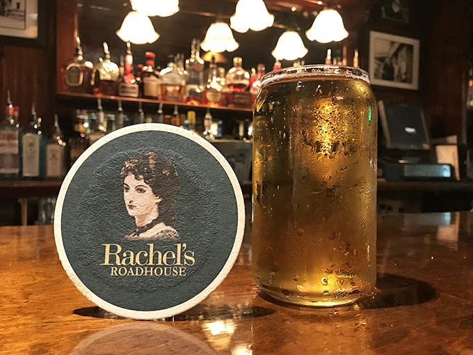 A perfectly poured beer beside the Rachel's coaster&mdash;like a golden sunset in a glass, just waiting to complement whatever deliciousness you've ordered.