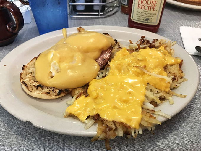 Eggs Benedict with a blanket of hollandaise that flows like liquid gold—proof that breakfast can be both comforting and sophisticated.