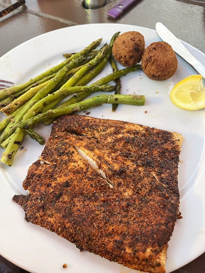 Blackened mahi with grilled asparagus proves that healthy choices don't have to feel like punishment for past culinary sins.