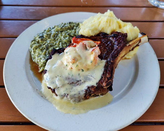 The bone-in ribeye arrives like a work of art, accompanied by creamed spinach and mashed potatoes that would make your grandmother jealous.